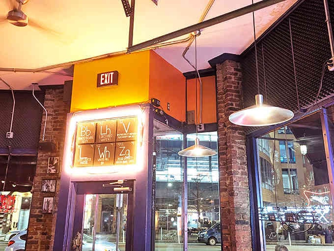 Even the exit sign gets the periodic table treatment, because commitment to a theme is everything in life.