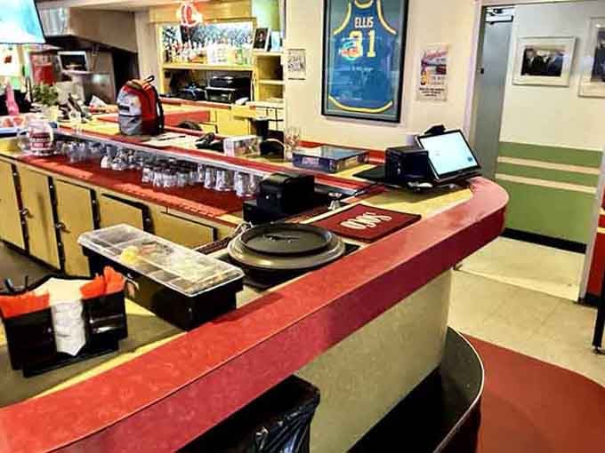 The classic diner counter where solo diners become regulars and coffee cups never run completely empty for long.