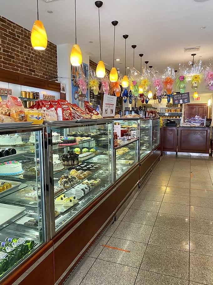 Display cases packed with colorful Italian cookies and pastries, each one a small edible work of art.