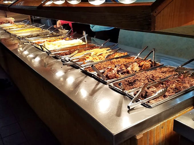 The buffet line stretches out like a delicious dream, each pan holding its own smoky treasure.
