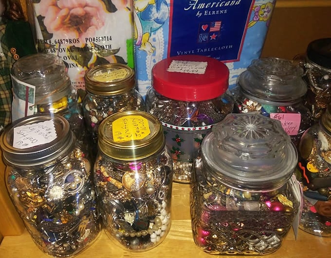 Mason jars filled with costume jewelry: the ultimate "one person's junk is another's treasure" philosophy in action.