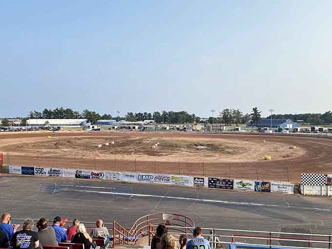 The Motor Speedway delivers the quintessential American soundtrack—engines roaring while spectators debate the merits of mustard versus ketchup on their hot dogs.