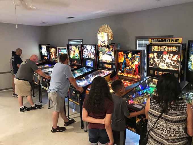 Multiple generations discovering that the best entertainment doesn't require WiFi, just working flippers and a little friendly competition.