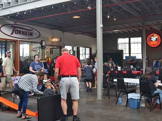 Real people enjoying real history; this museum brings generations together over shared appreciation for mechanical artistry.