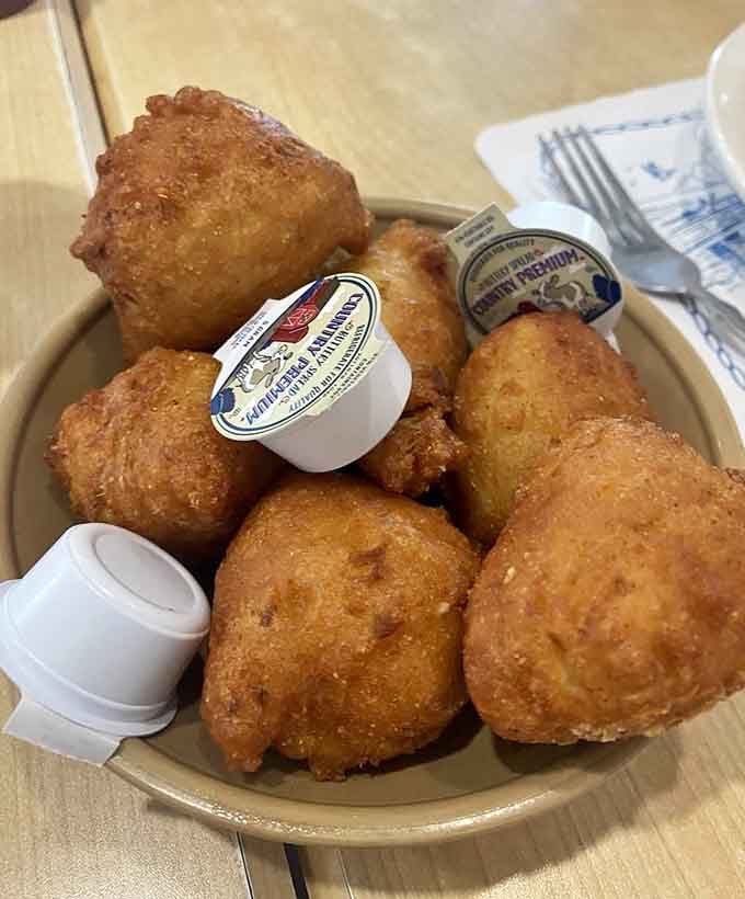 Golden hush puppies that could make a grown person weep with joy, crispy outside and fluffy within.