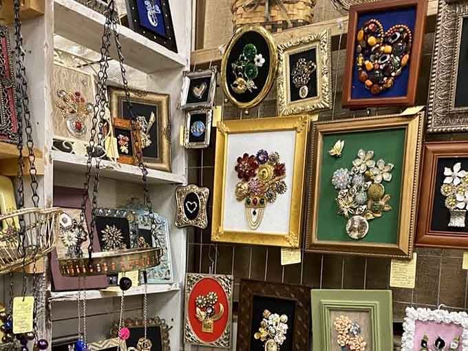 Wall art made from vintage jewelry because someone brilliantly decided brooches deserved a second act.