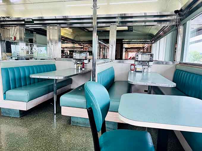 The dining room stretches on like a chrome-lined hallway to happiness, booth after booth of comfort food possibilities.