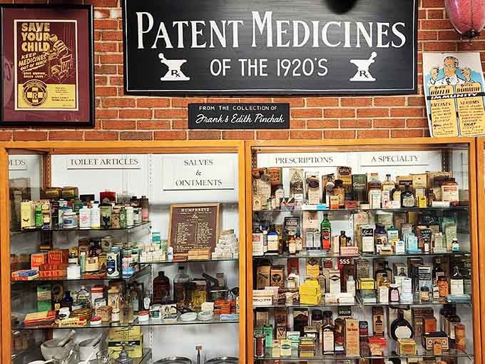 Patent medicines from the 1920s line these shelves like a pharmacy time capsule of questionable cures.