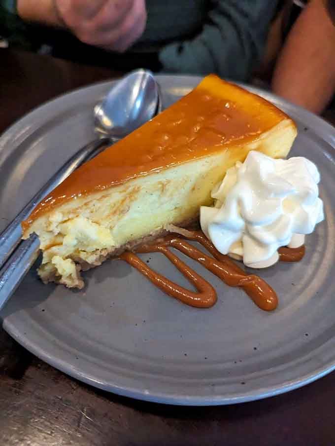 Cr&egrave;me br&ucirc;l&eacute;e cheesecake with caramel drizzle and whipped cream is the kind of dessert that makes you reconsider your dinner plans.