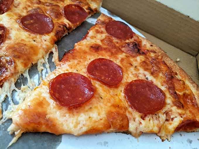 Pizza slices with pepperoni and gloriously melted cheese, because variety is the spice of life and lunch.