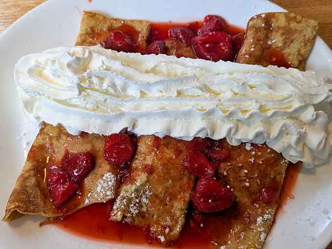 Strawberry crepes topped with whipped cream that could make a French chef nod approvingly while loosening their belt.