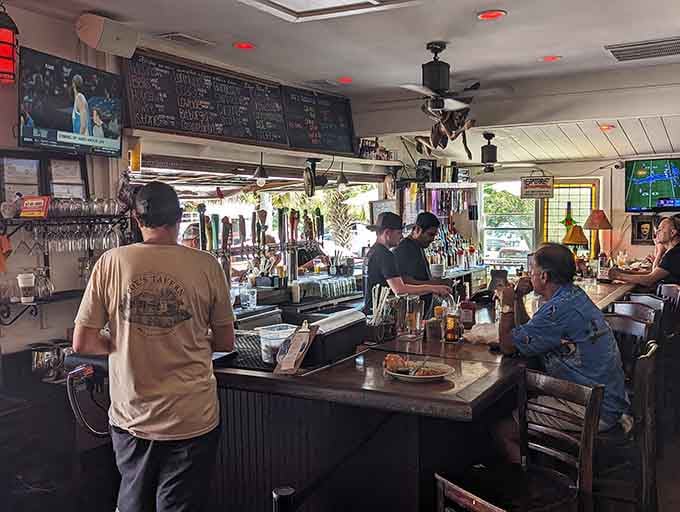 The bar area buzzes with conversation while chalkboard menus display daily specials and an impressive beer selection.