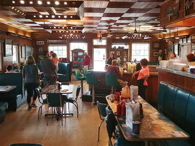 Rows of booths ready to host families, friends, and solo diners united by their appreciation for authentic pit-cooked barbecue.