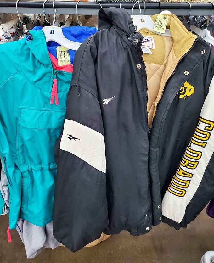 Vintage jackets hanging like a timeline of fashion history, each one with stories we'll never quite know.