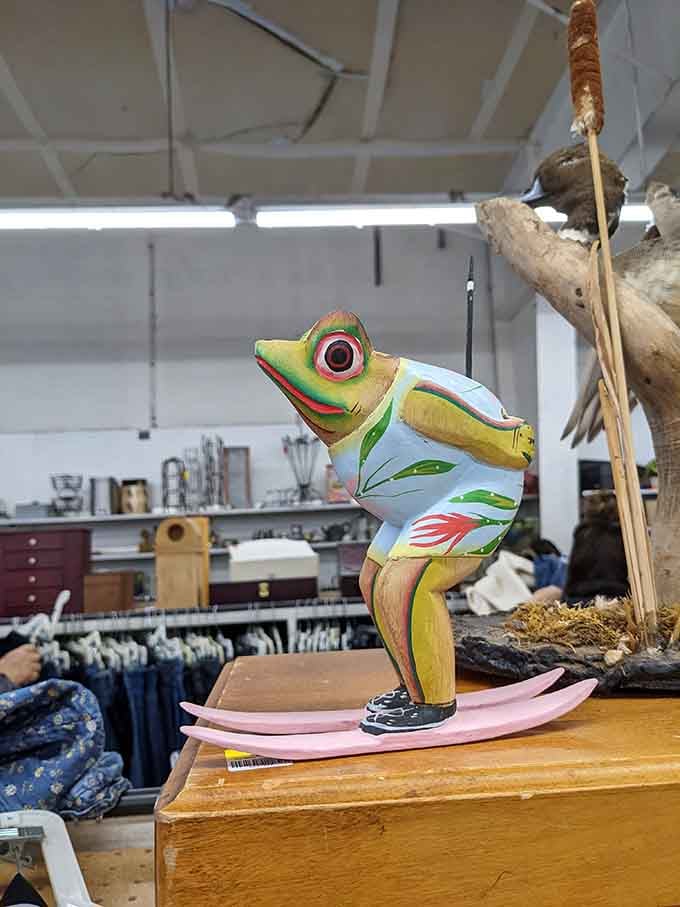 A hand-painted frog perched on driftwood brings whimsical charm to someone's future mantelpiece or garden display.