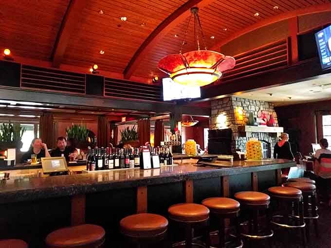 The well-stocked bar with its polished wood and inviting stools beckons you to settle in awhile.