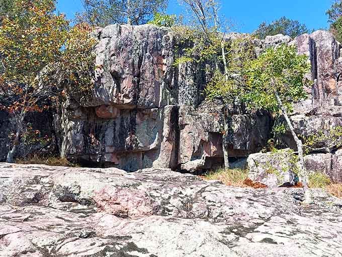 Towering rock walls frame the landscape like a natural cathedral built by geological forces over eons.