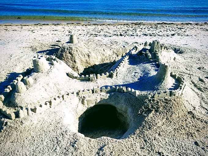 Someone's architectural masterpiece in sand will last until the next high tide, which is oddly poetic.