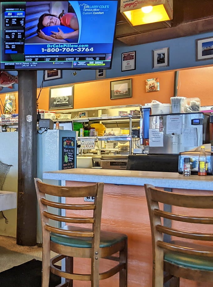 Service counter efficiency meets friendly faces, the engine room where seafood magic happens before your eyes.