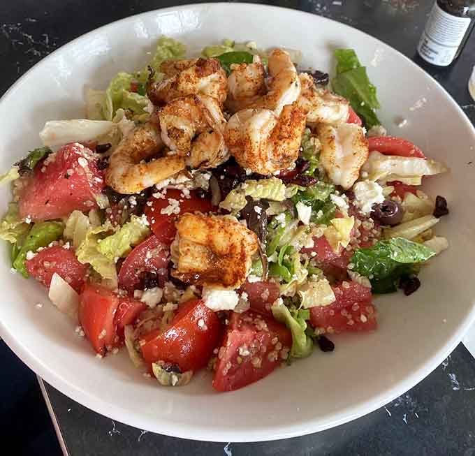 Fresh shrimp crowns a colorful salad that makes eating your vegetables feel less like duty, more like pleasure.