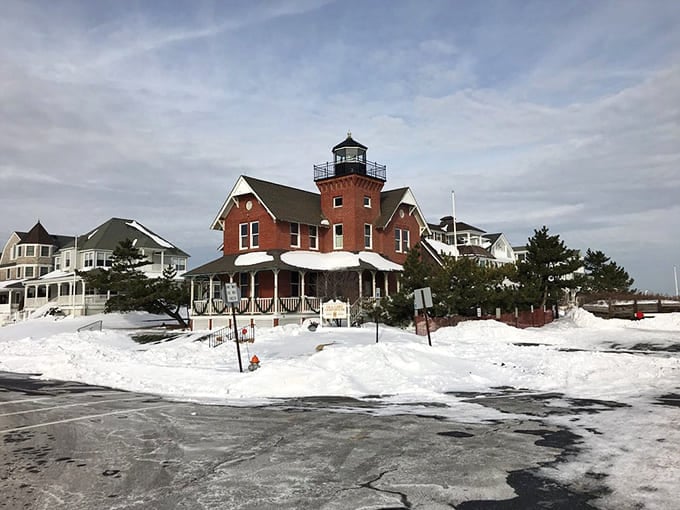 Even blanketed in snow, this architectural oddity stands proud, proving lighthouses work year-round regardless of weather.