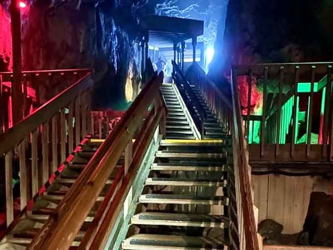 Stairs lit like a disco lead deeper into the earth, proving caves can be fabulous.