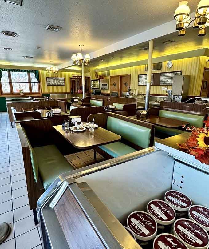 Mint green booths and white tile floors create a timeless diner aesthetic that never goes out of style.