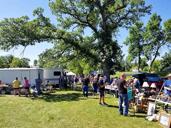 Crowds gather under towering trees where shade and shopping combine for the perfect summer weekend treasure-hunting expedition.