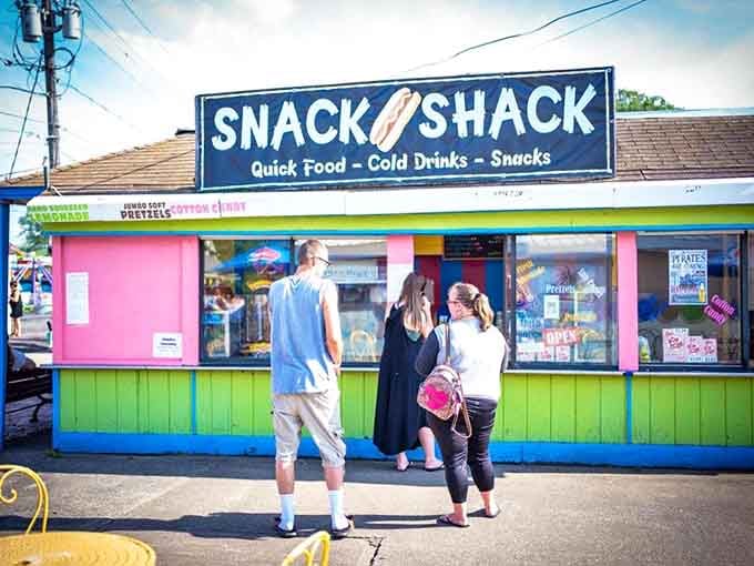 The Snack Shack's vibrant facade promises all the essential food groups of summer: fried, frozen, sugary, and absolutely worth every calorie.
