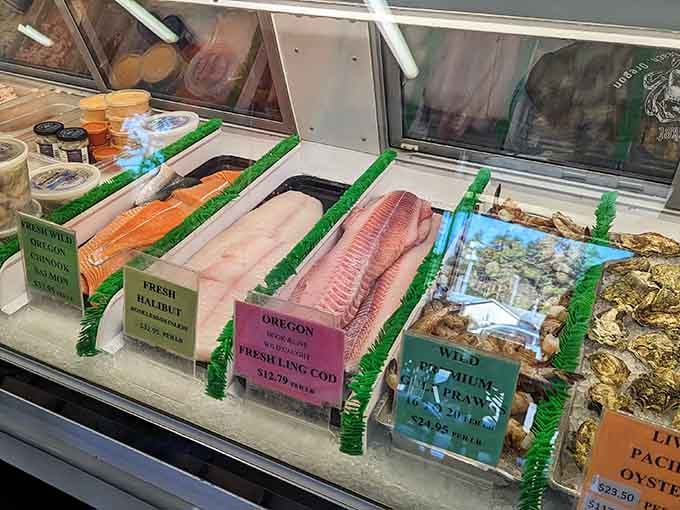 Fresh fillets and whole fish displayed on ice like aquatic artwork, reminding you this place takes its seafood seriously indeed.