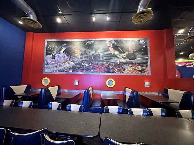 Booth seating beneath space murals makes every meal feel like you're part of the adventure.