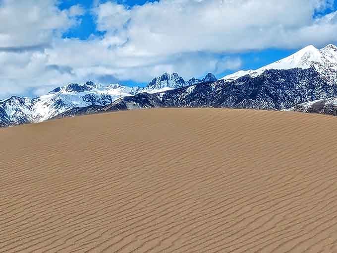 Fresh snow on the Sangre de Cristos creates a postcard-perfect contrast with the warm desert tones below.