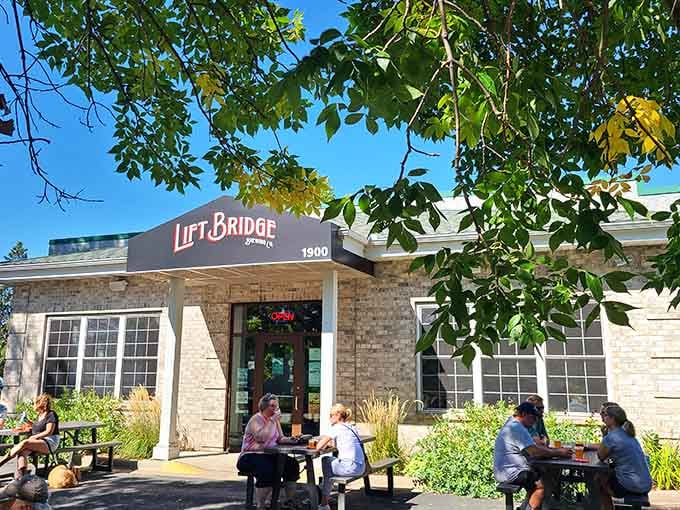 Lift Bridge Brewing combines craft beer culture with sunny patios, creating the perfect spot for afternoon refreshment and conversation.