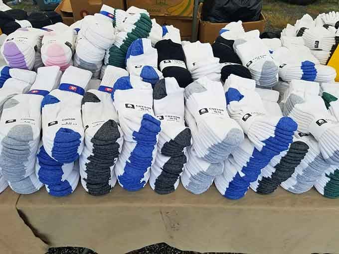 Socks in bulk, because apparently even flea markets understand that you can never have too many matching pairs available.