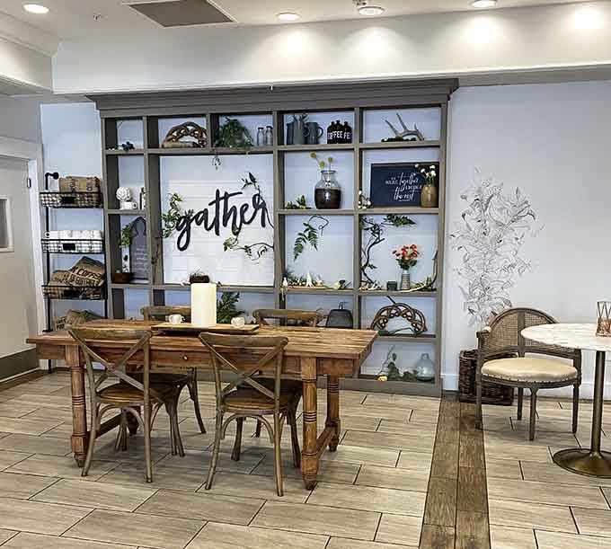 Rustic farmhouse tables and that "gather" wall make this the kind of place where strangers become friends over pastries.