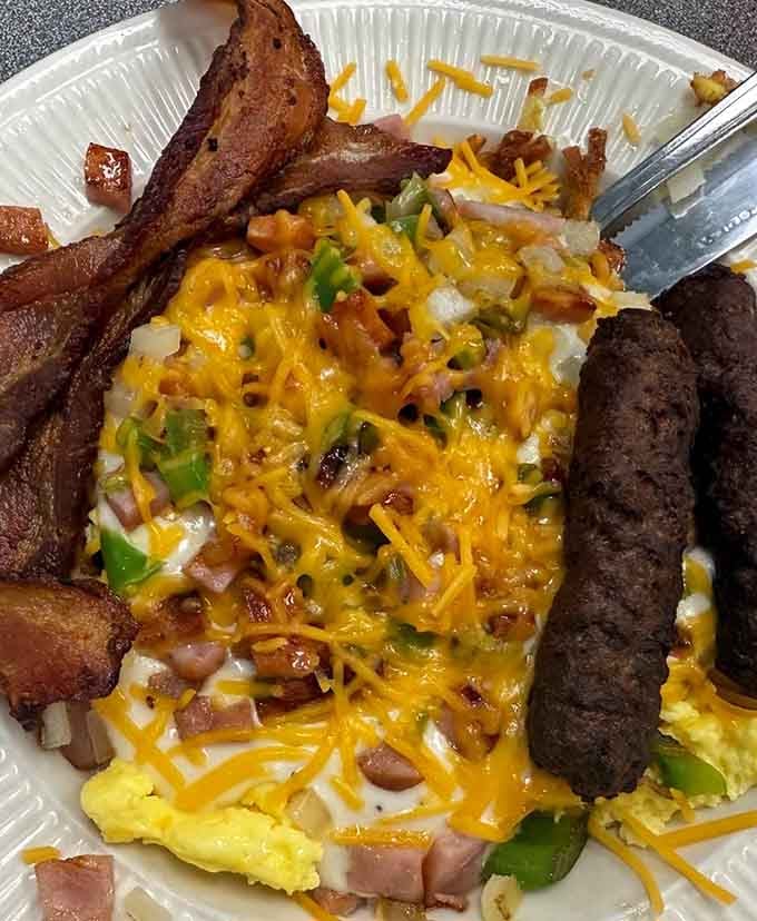 This breakfast skillet is what happens when eggs, cheese, and various breakfast meats decide to throw the party of the century.