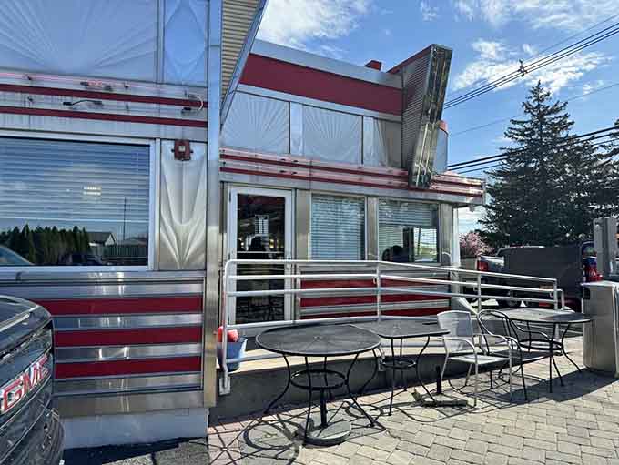 Outdoor seating lets you enjoy your meal while admiring that stunning retro architecture in natural light.