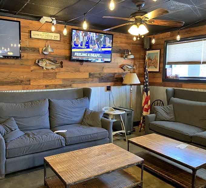 Plush couches and mounted fish create a living room vibe where watching the game feels like hanging at your buddy's house.