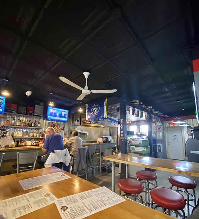 Industrial chic meets neighborhood comfort, where corrugated metal walls tell stories of American craftsmanship and good times.