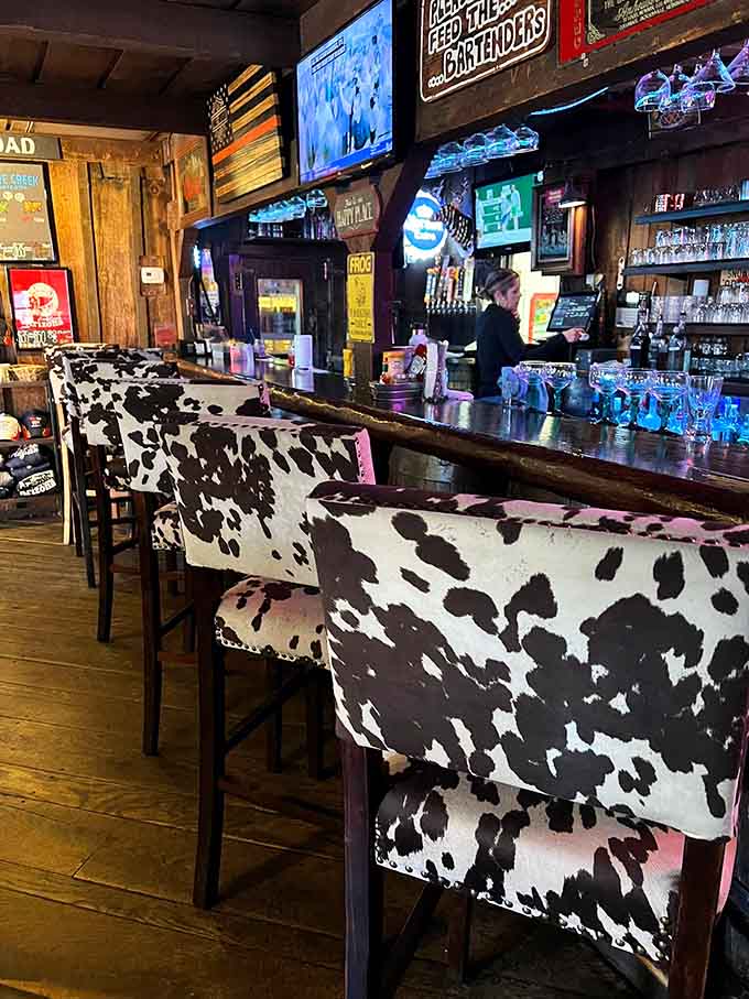 Bar stools wrapped in cowhide because subtlety was never part of the plan, and we love that commitment.
