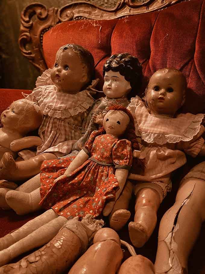 These porcelain playmates have seen better days, huddled together like they're plotting something while you're not looking.