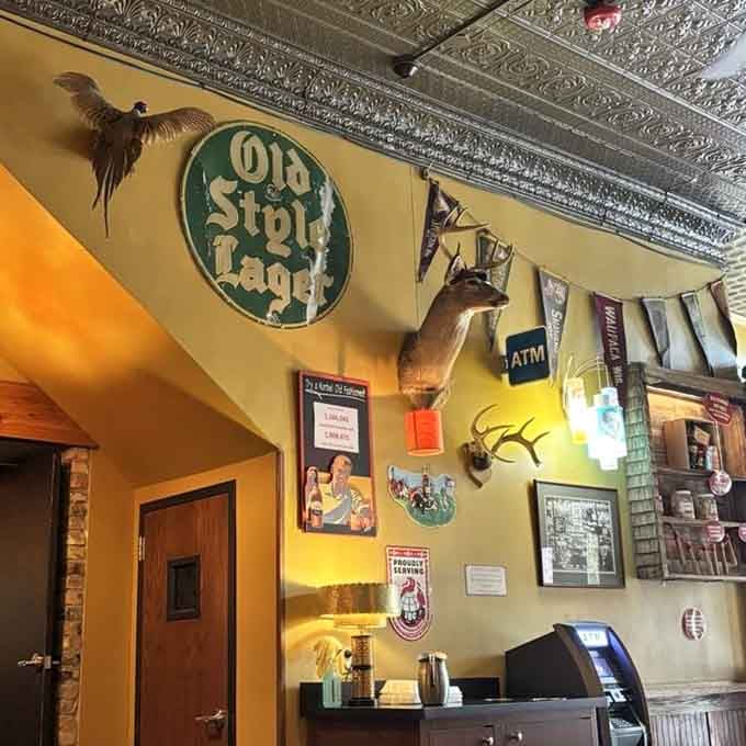 Old Style Lager sign and mounted deer head, because nothing says Wisconsin quite like beer and hunting nostalgia.
