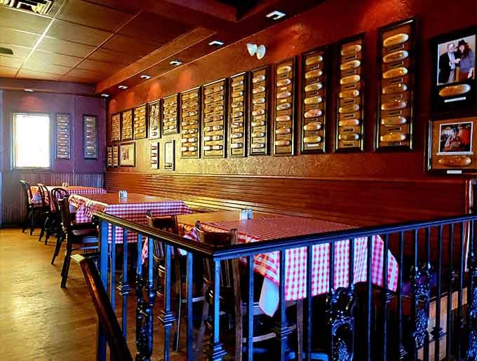 The upstairs dining room where hundreds of signed hot dog buns watch over you while you eat&mdash;delightfully weird.