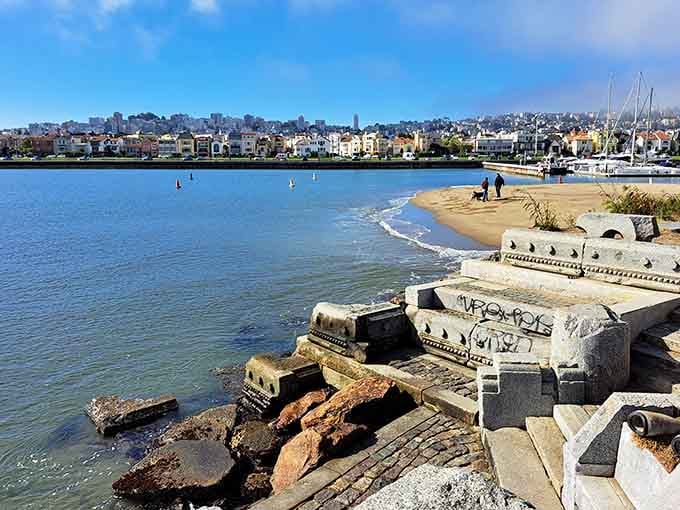 Small beaches form around the sculpture, perfect spots for watching sailboats drift past Alcatraz in the distance.