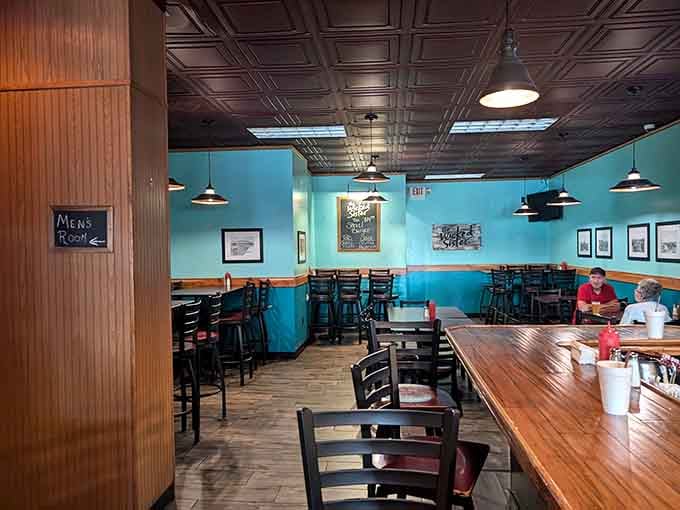 Bright turquoise walls and comfortable booths create a space where you can settle in for a proper meal.