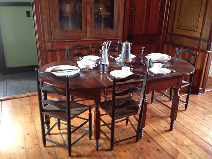 Gather round this table where formal dining meant something more than eating over the kitchen sink.