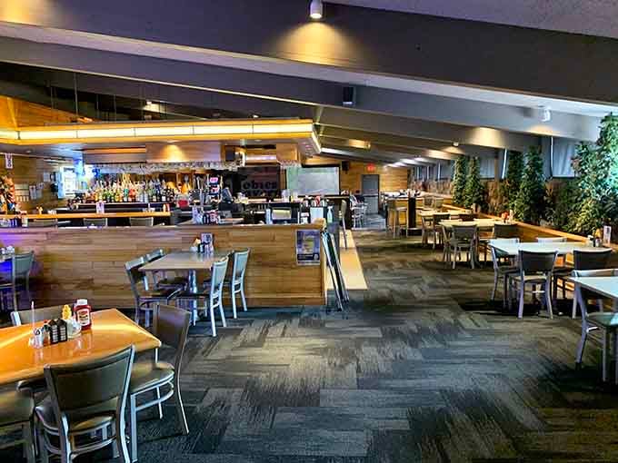 The bar area beckons with modern comfort and the promise of beverages to complement those rolls.