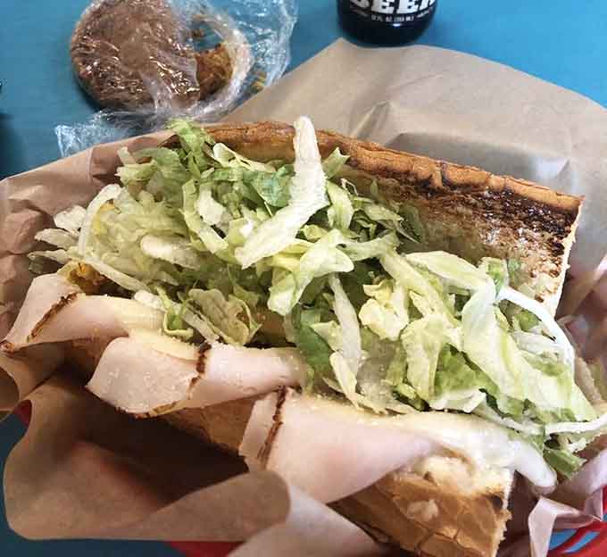 Turkey piled so high it's practically architectural, with enough fresh lettuce to make you feel virtuous about your lunch choice.