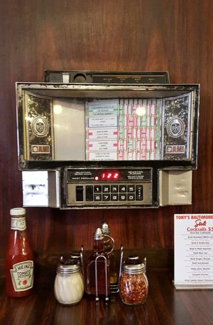 These vintage jukeboxes at every table are basically time machines that play your favorite oldies.