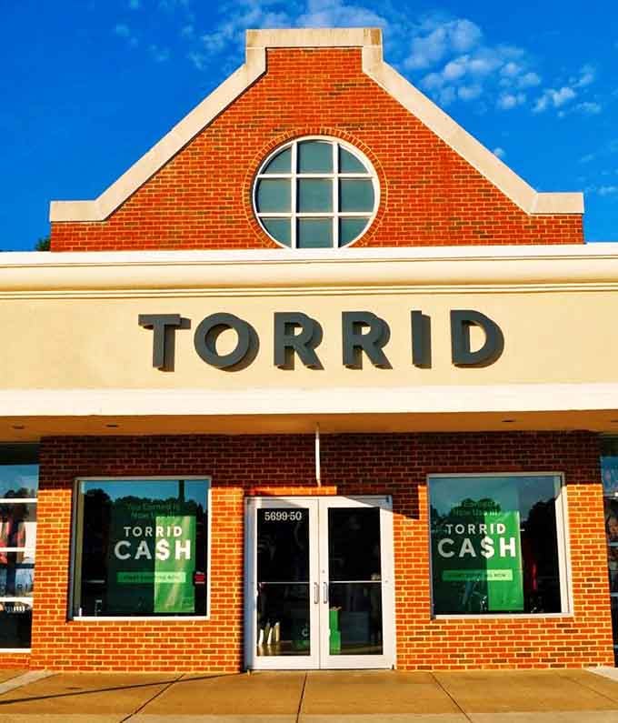 Torrid's inviting storefront welcomes shoppers of all sizes. Those green "CASH" signs speak a universal language every shopper understands.